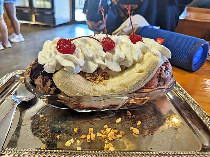 The banana split arrives like royalty on a silver platter &ndash; a classic dessert elevated by Moomers' exceptional ice cream craftsmanship.
