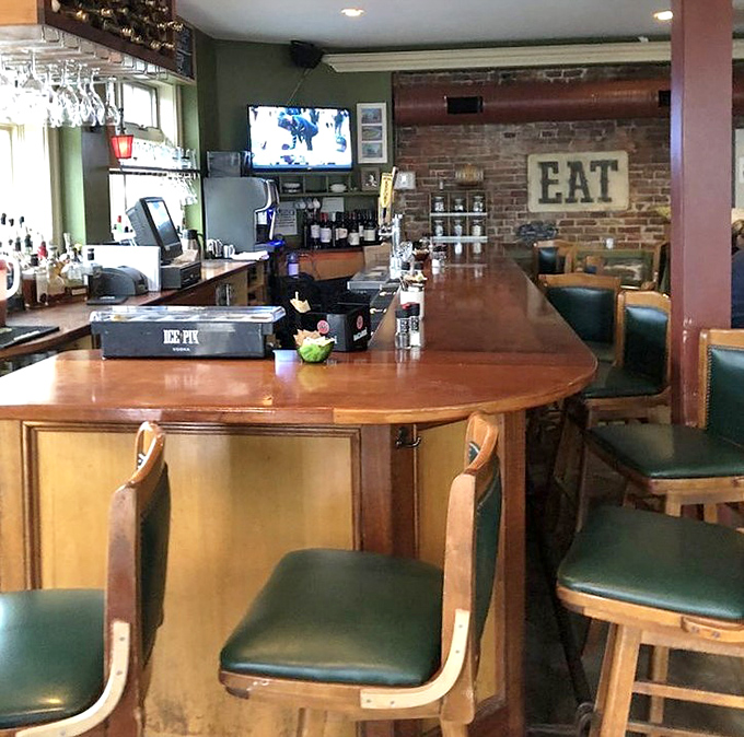 The welcoming bar area, complete with that "EAT" sign that needs no explanation &ndash; good advice is often the simplest.