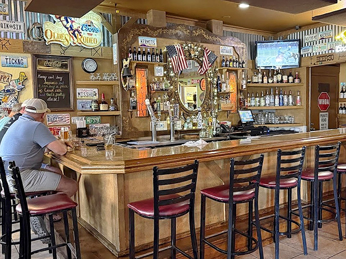 The bar area buzzes with local energy, license plates and memorabilia creating the perfect backdrop for cold beers and warm conversations.