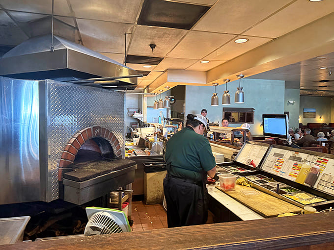 Behind the scenes where the magic happens, complete with that beautiful wood-fired oven doing the Lord's work daily.