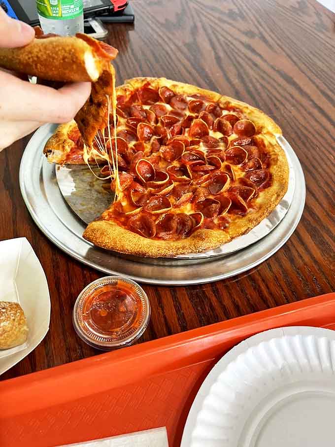 Those perfectly cupped pepperoni creating little pools of savory goodness are the hallmark of pizza made with attention to delicious details.