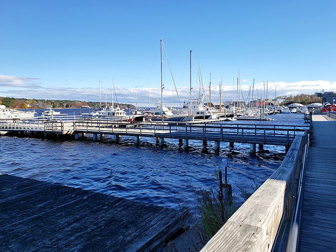 Belfast's harbor walk showcases the working waterfront, where sailboats bob gently against a backdrop of Maine's coastal beauty.