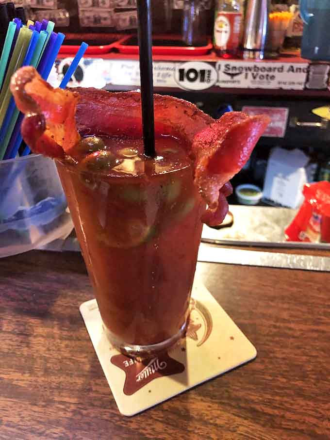 A Bloody Mary garnished with bacon strips that stand at attention like meaty soldiers&mdash;because your drink should be as substantial as your meal.
