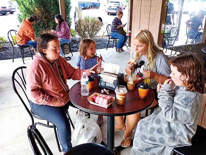 Families gather around tables, creating memories sweeter than the treats they're enjoying &ndash; the real magic of Brant's Orchard.