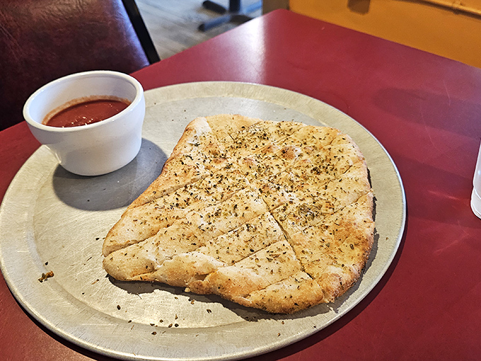 Crispy chicken fillet seasoned simply and served with marinara, showing care and flavor in every bite.