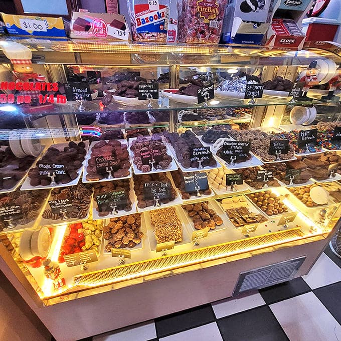 A glass case of chocolate temptations that would make Willy Wonka envious. Resistance is futile, so why even try?