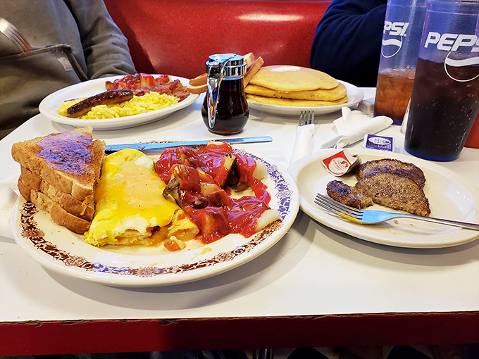 Fluffy, golden, and stuffed with more goodies than Santa's sleigh. This omelet is the breakfast of champions and regular folks alike.