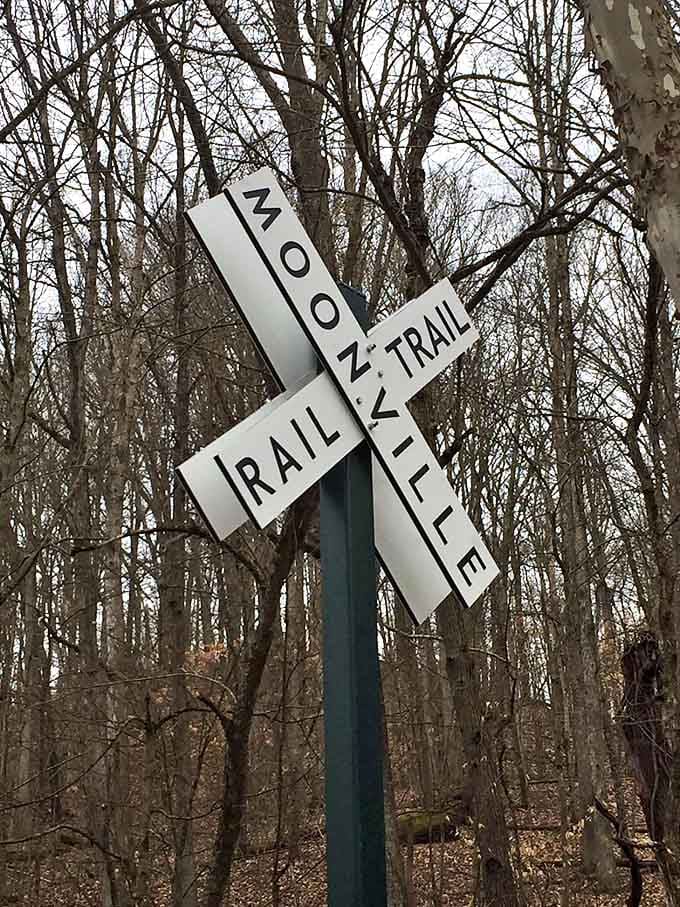 The trail signs stand like silent sentinels, guiding curious explorers toward Moonville's legendary tunnel.