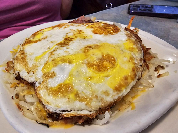 Morning motivation on a plate! Crispy corned beef hash topped with sunny-side-up eggs &ndash; it's breakfast with attitude.