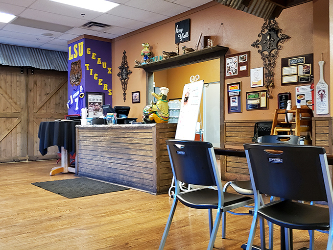The counter area showcases Louisiana pride with memorabilia and a warm, rustic design that makes ordering takeout feel like visiting old friends.