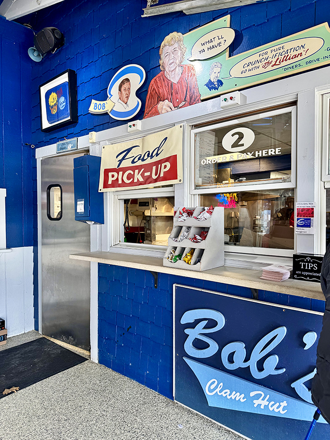 The pickup counter where dreams come true, complete with vintage artwork that tells the story of this beloved Maine institution.