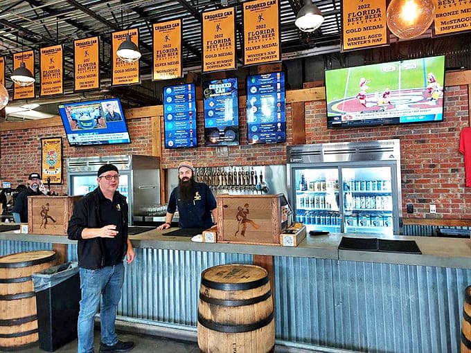 Where the magic happens – Crooked Can's bar area combines industrial elements with warm hospitality for a truly inviting experience.