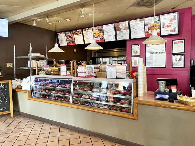 The counter where magic happens daily &ndash; pink walls and glass cases filled with treats that make decision-making the day's most delicious challenge.