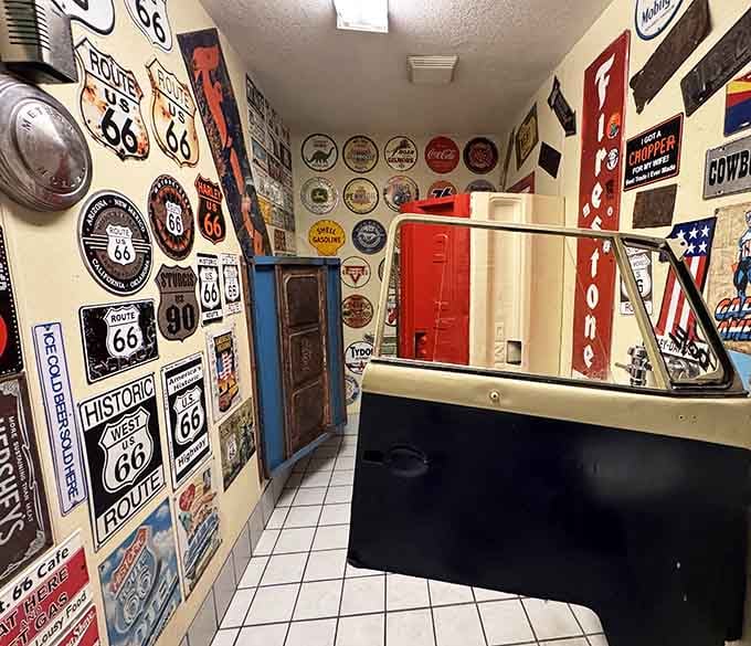 Even the restroom gets the full Route 66 treatment, with walls covered in nostalgic signs that make every visit memorable.