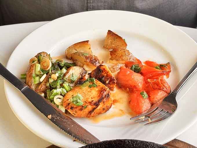 Adana Tavuk features yogurt-marinated chicken that stays impossibly moist while developing beautiful color from paprika seasoning.