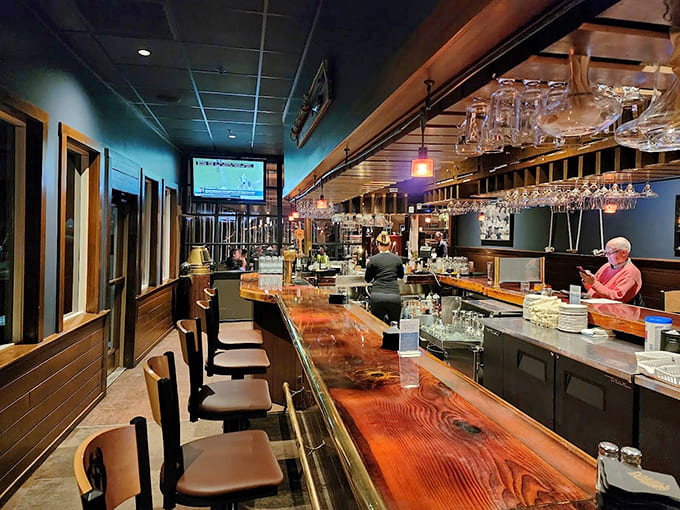 The bar beckons with polished wood and the promise of well-crafted cocktails, making it dangerously easy to linger.