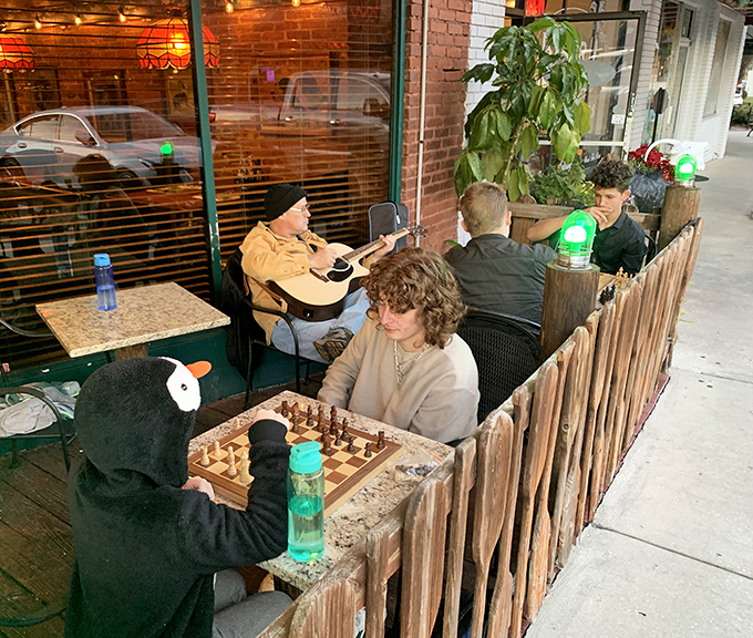 Chess games and casual gatherings on the patio speak to Stumpknockers' role as a community gathering place, not just a restaurant.