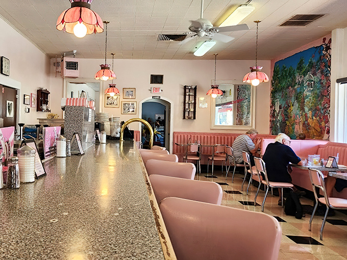 The counter where magic happens &ndash; pink seats invite you to spin (just once) while soda jerks create concoctions that defy gravity and willpower.