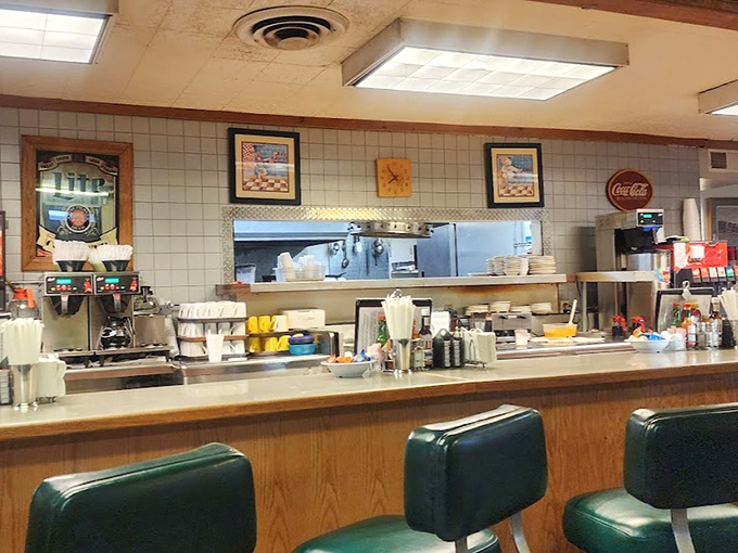 The counter seats offer front-row views of breakfast theater, where regulars exchange news while waitresses orchestrate the morning rush.
