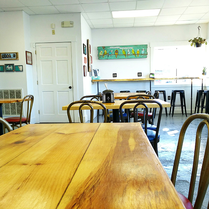 The minimalist space lets conversation and food take center stage, with simple furnishings and natural light creating a welcoming atmosphere.