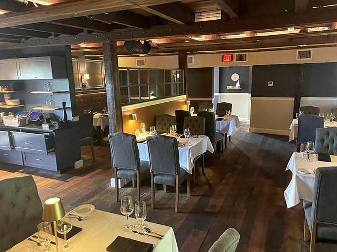 Warm woods and crisp linens create an atmosphere where conversations flow as smoothly as the excellent wine selection.