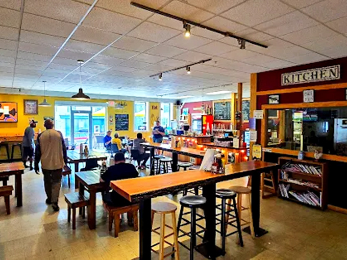 Communal tables invite strangers to become friends over shared plates and sauce recommendations in this warmly lit space.