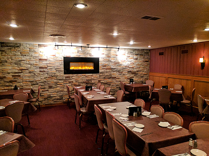 Stone fireplace warms the private dining area &ndash; where memories are made between bites of exceptional food.
