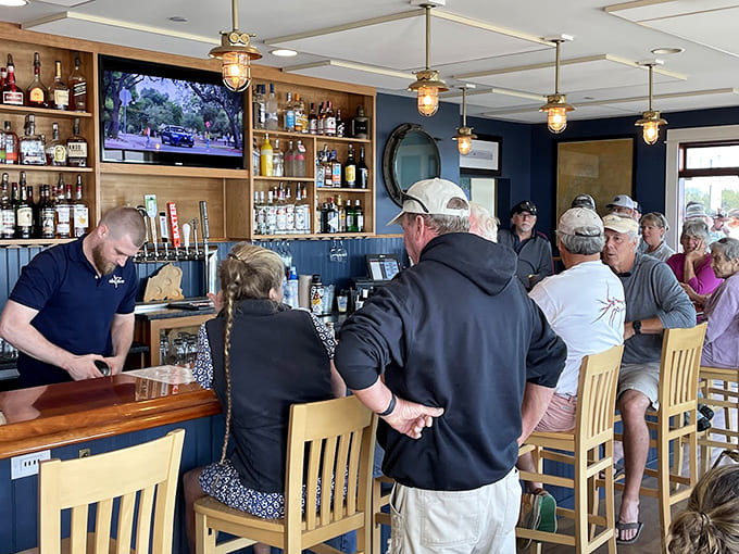 The bar area buzzes with friendly conversation and the kind of casual camaraderie that defines the best coastal Maine establishments.