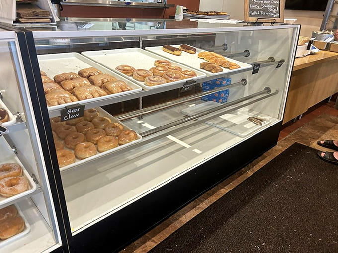 Fresh donuts displayed behind glass showcase the bakery side of this dual-threat establishment that does everything well.