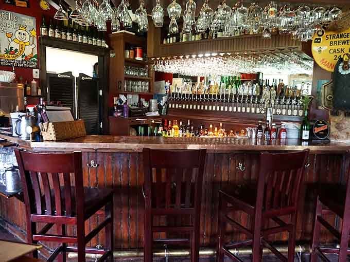The bar area gleams with promise, featuring an impressive selection that would make any beer enthusiast weak in the knees.