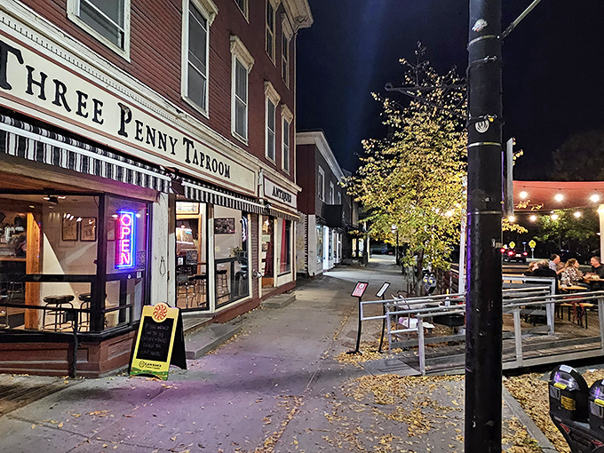 As evening falls, Three Penny Taproom glows like a beacon for those seeking exceptional food, drink, and the warmth of community connection.