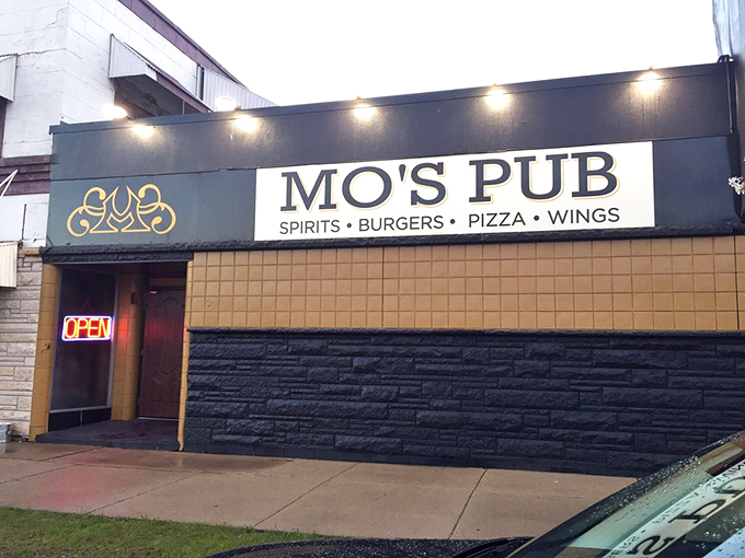 More than just a sign, it's an invitation to flavor town. Mo's Pub: where every visit is a celebration.