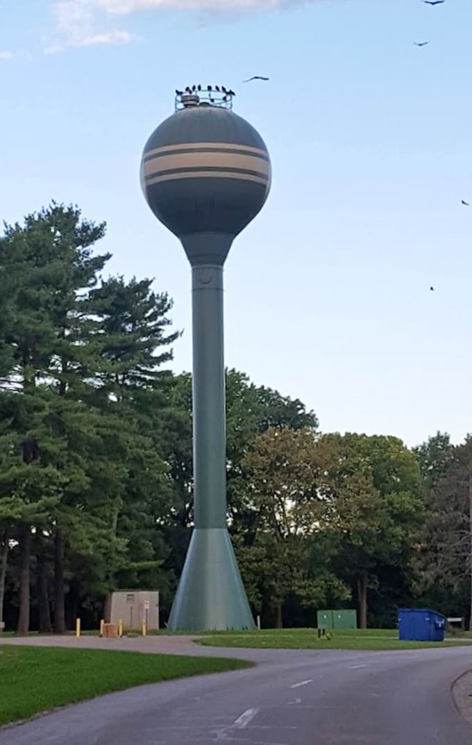The Fayette water tower standing tall like a lighthouse for landlocked travelers, guiding you to small-town charm and great camping.