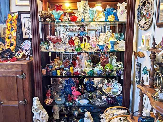 Glass cabinets showcase delicate figurines and colorful collectibles that survived decades of dusting, each piece waiting for its next caretaker.