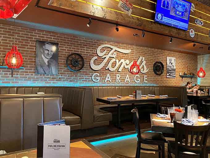 Cozy booths feature Ford's Garage branding and vintage photographs, offering comfortable seating with plenty of automotive eye candy.