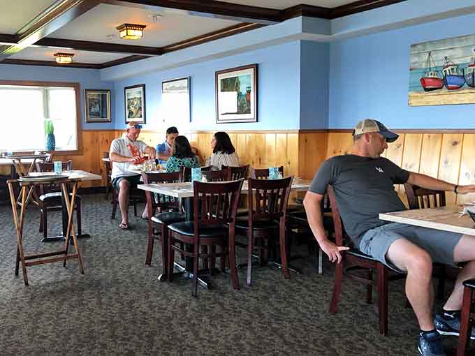 Happy diners enjoying their seafood in a relaxed atmosphere where the dress code is "came from the beach, going back."