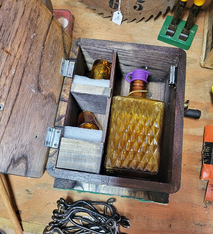 This wooden box reveals its secret stash &ndash; an amber glass decanter nestled in custom compartments, waiting for its next cocktail hour.