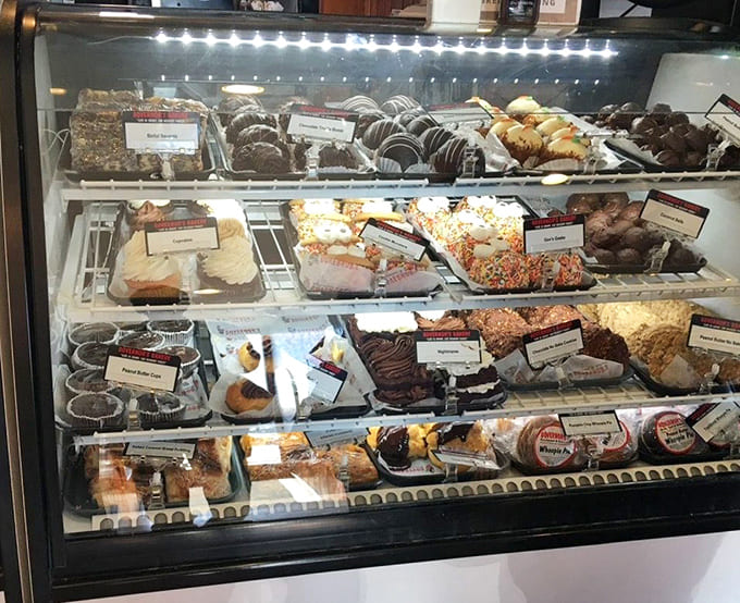 Multiple shelves of cakes, pies, and pastries create a dessert dilemma that's actually quite pleasant to have.