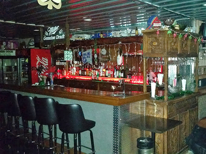 The bar glows with possibility, bottles lined up like soldiers ready to serve whatever your evening requires.