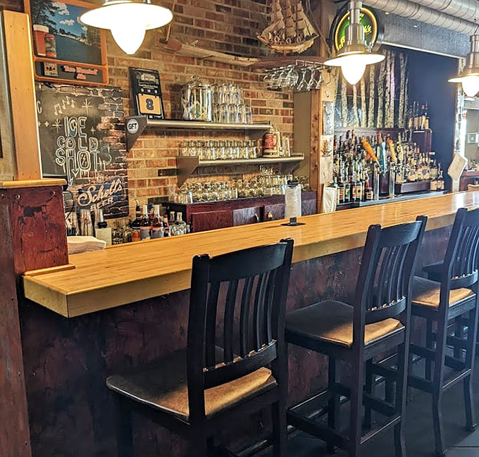That well-stocked bar with its impressive tap selection and brick backdrop practically begs you to pull up a stool and stay awhile.