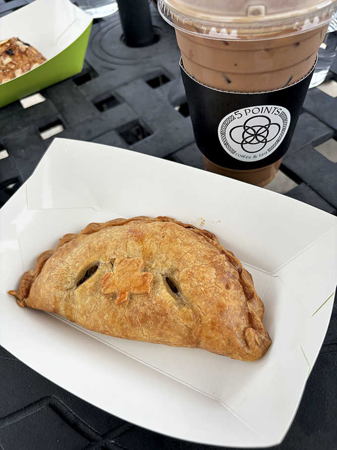 This isn't just a hand pie &ndash; it's a portable feast with a golden-brown crust that shatters just right, revealing a filling worth crossing town for.