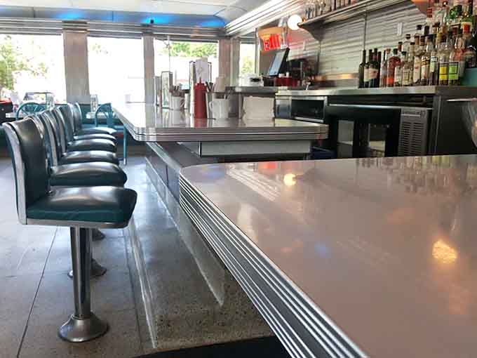 The counter offers front-row seats to the breakfast show, where eggs get flipped and hash gets pressed with practiced precision.