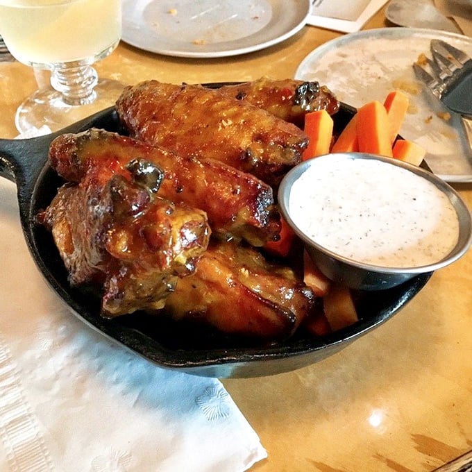 Honey habanero wings strike the perfect balance between sweet and heat, with a side of cooling ranch and crisp vegetables.