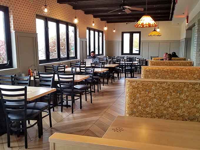 Spacious seating with wooden tables and comfortable chairs invites lingering over coffee and conversation.