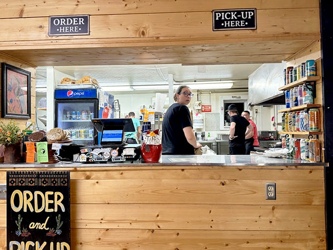 The order counter displays a well-organized operation where friendly staff turn hungry customers into happy, satisfied regulars.