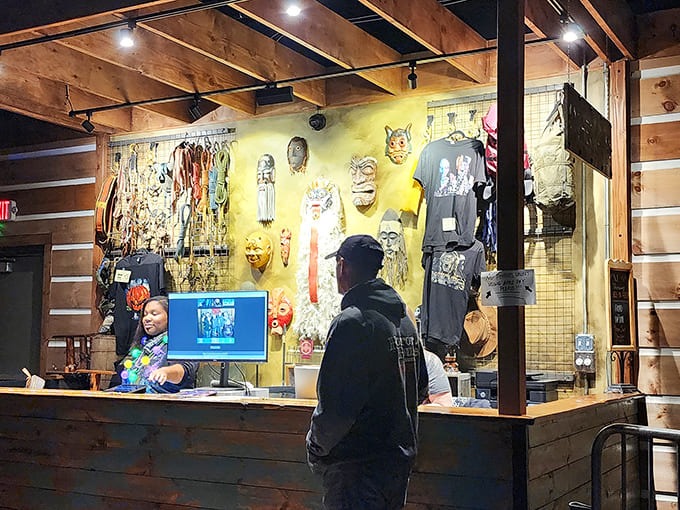 The merch counter offers souvenirs for survivors &ndash; tangible proof you braved both the scares and the spirits.