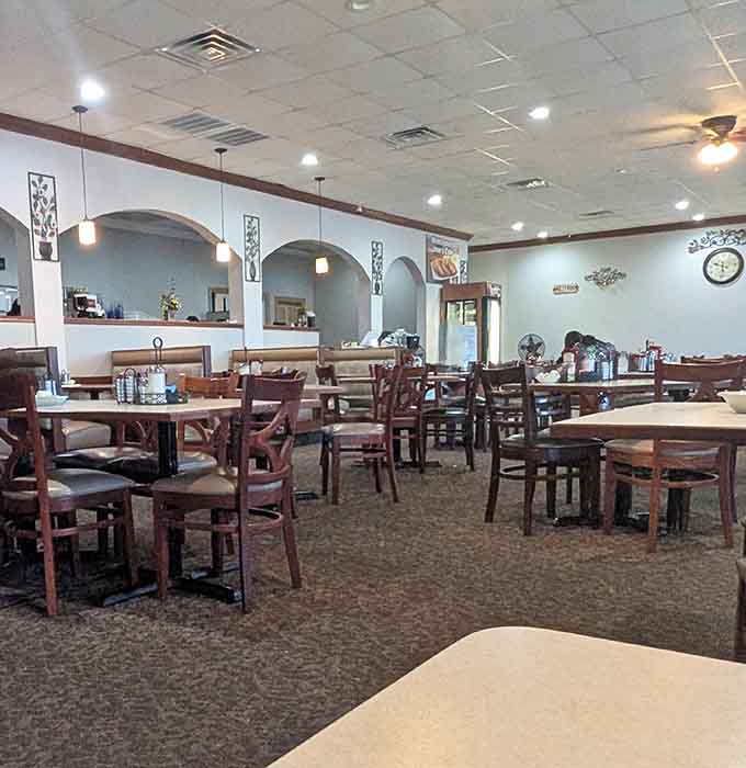 Another angle of the welcoming interior shows why diners feel comfortable lingering over coffee and conversation at Imo's Cafe.