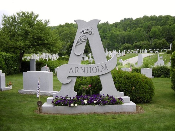 The massive Arnholm "A" transforms a simple initial into a monumental sculpture, proving that sometimes the simplest designs make the boldest statements.