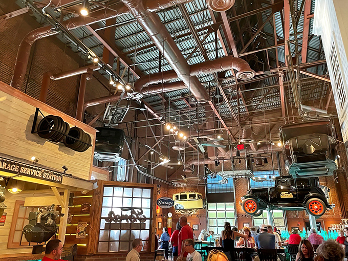 The soaring industrial ceiling showcases more vintage vehicles &ndash; proof that at Ford's Garage, the classic car show happens indoors, all day long.