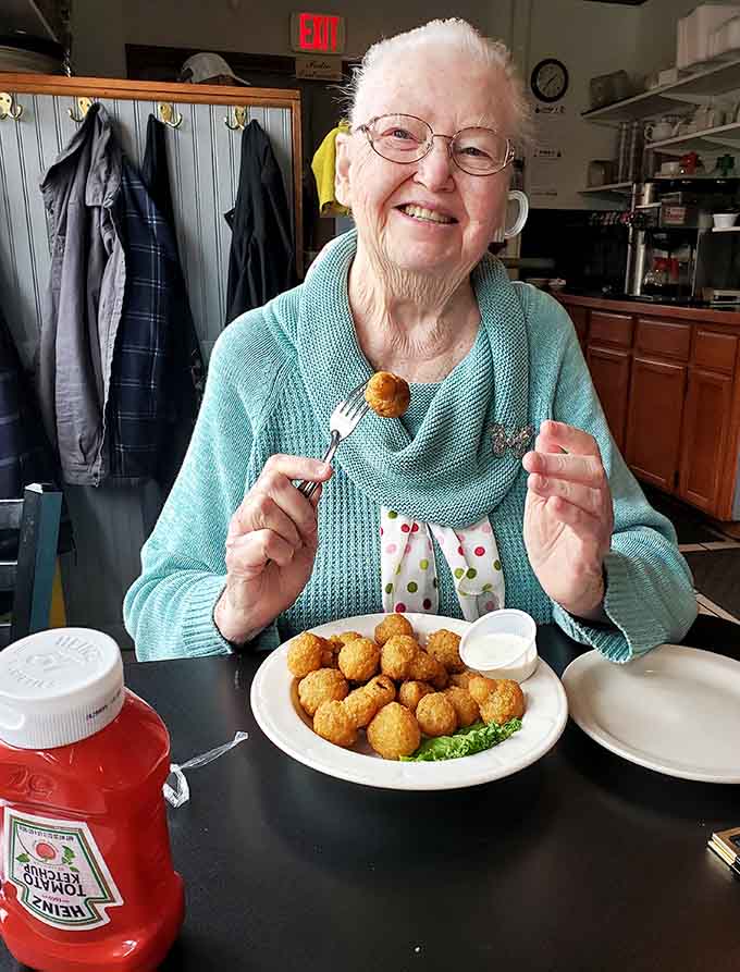 When the food makes you this happy, age is just a number and those tater tots are just the beginning of a beautiful friendship.